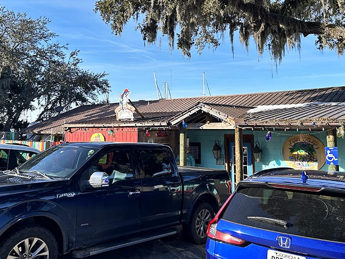 Draped in Spanish moss like nature's own curtains, this colorful gem beckons with coastal charm and promise. 