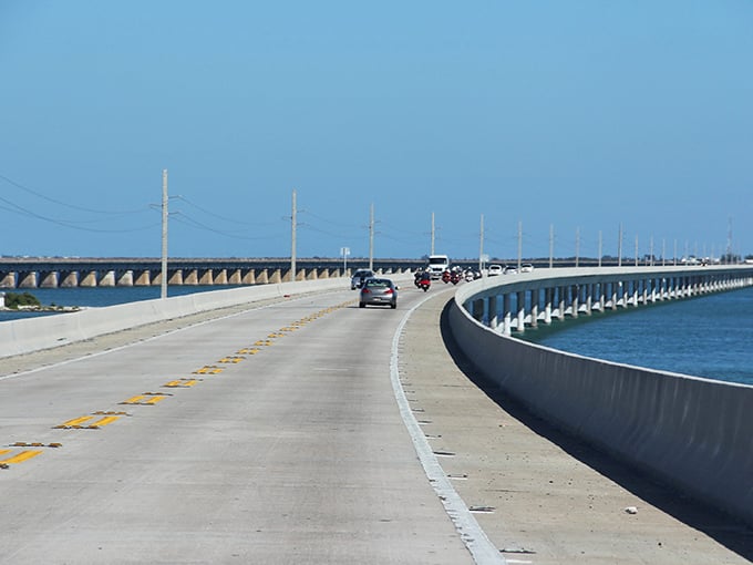 The Overseas Highway stretches across impossibly blue waters, making you feel like you're driving on liquid sapphires.