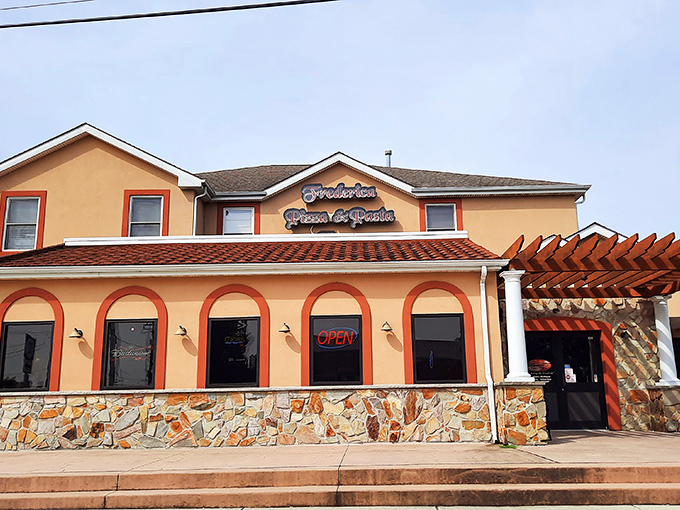 Frederica Pizza's bold orange facade stands out like a sunset. This isn't just a restaurant&mdash;it's a landmark for hungry travelers.