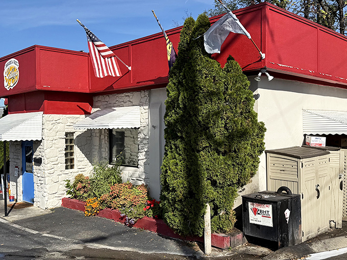 Gabby's red-topped fortress of flavor stands guard on a Nashville corner. This unassuming burger bunker houses treasures that would make any fast food chain weep with envy.
