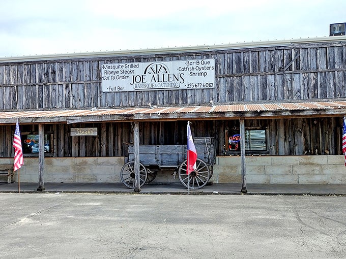 Joe Allen's weathered wooden exterior is like a time machine to old Texas, complete with wagon and flags standing proud.