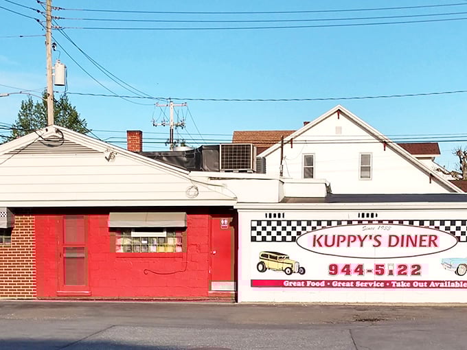 Kuppy's red exterior and checkered pattern scream "classic American diner" louder than a short-order cook calling "Order up!"