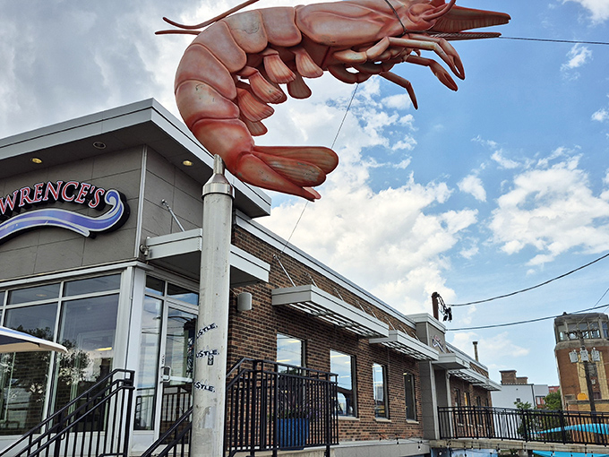That giant shrimp sculpture isn't compensating for anything—Lawrence's seafood really is that impressive!