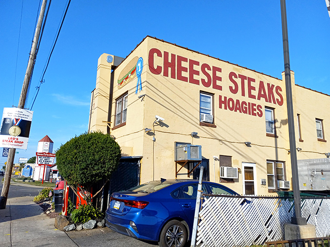 Leo's bold signage doesn't mince words: CHEESE STEAKS HOAGIES. Sometimes the simplest advertising speaks the delicious truth.