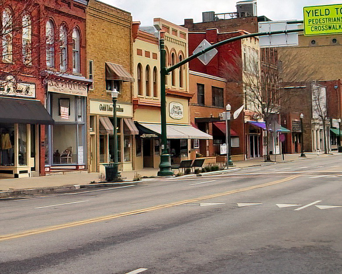 Historic brick buildings standing shoulder to shoulder like old friends who've weathered a century together.