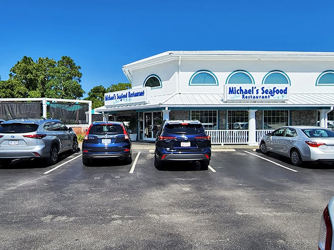 Michael's Seafood's pristine white facade stands like a beacon of hope for hungry beach-goers. Coastal elegance without pretension!