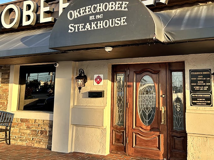 That elegant wooden door at Okeechobee Steakhouse isn't just an entrance &ndash; it's a time portal to steak perfection.