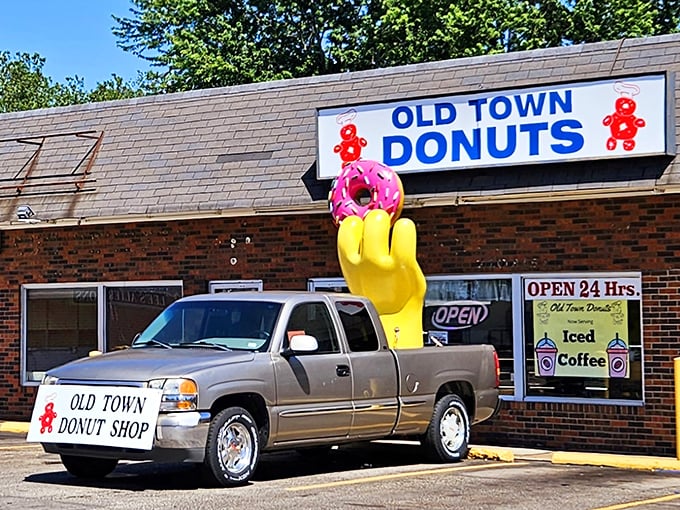 That giant yellow hand knows what's up! Old Town Donuts' 24-hour siren call means midnight cravings never go unanswered.