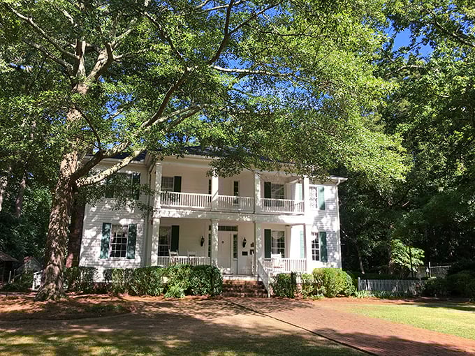 Classic Southern charm in white clapboard! This antebellum beauty at Stately Oaks looks ready for its Hollywood close-up.