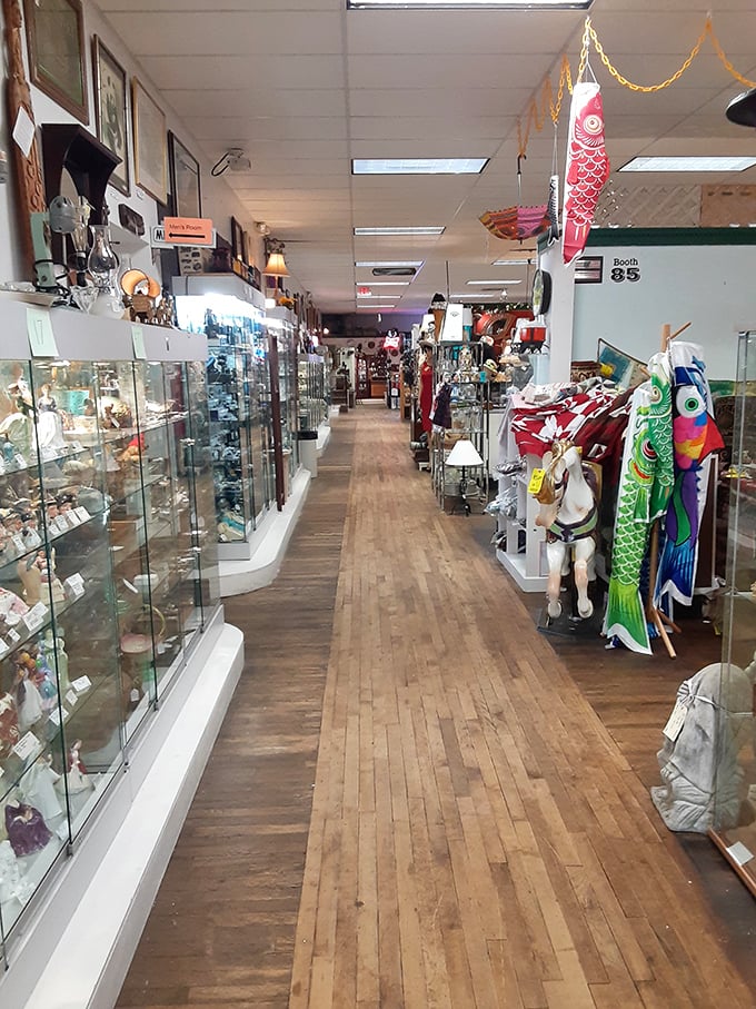 Glass cases glimmer with collectibles while colorful kites dance overhead. Treasure hunting at its finest!