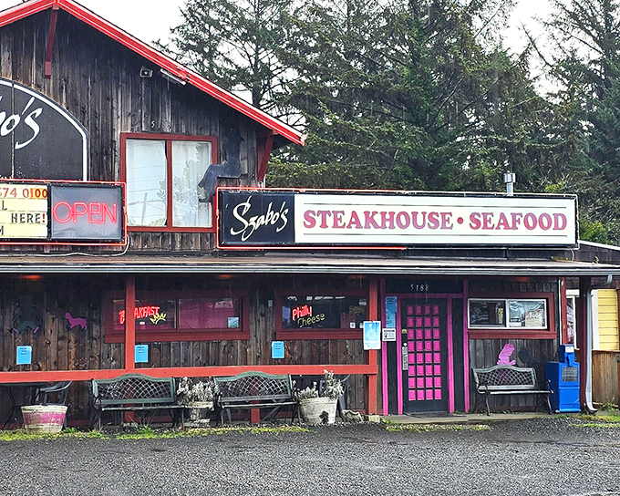 Szabo's pink door stands out like a charming rebel on the coast. Behind that weathered wood lies steak paradise waiting to be discovered.