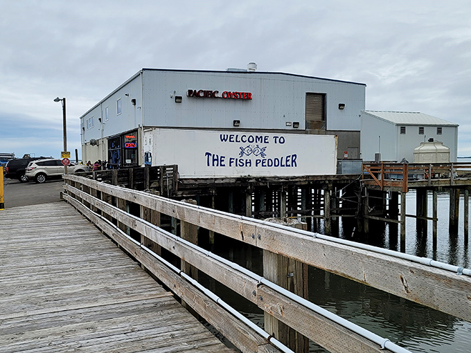 The Fish Peddler sits majestically on its waterfront perch. That wooden walkway might as well be a red carpet to seafood heaven.