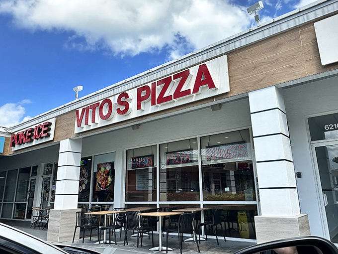 Vito's storefront keeps it real with that classic strip mall vibe. No pretension here, just the promise of perfect New York-style slices.