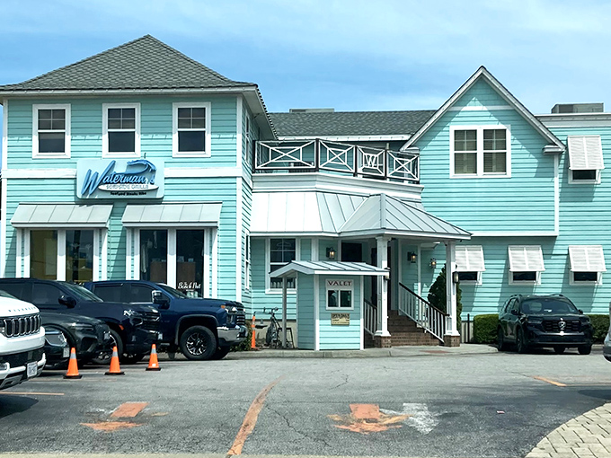 Turquoise dreams and seafood schemes! Waterman's coastal-colored building promises vacation vibes with every bite.