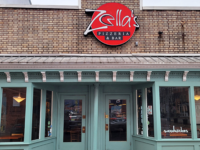 Zella's mint-green facade stands out like a delicious oasis in Baltimore. That brick building has seen generations of pizza lovers come through its doors.