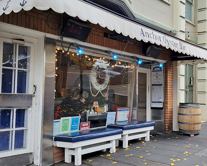 Those little blue benches outside Anchor Oyster Bar? They're where patience turns into the reward of spectacular seafood.
