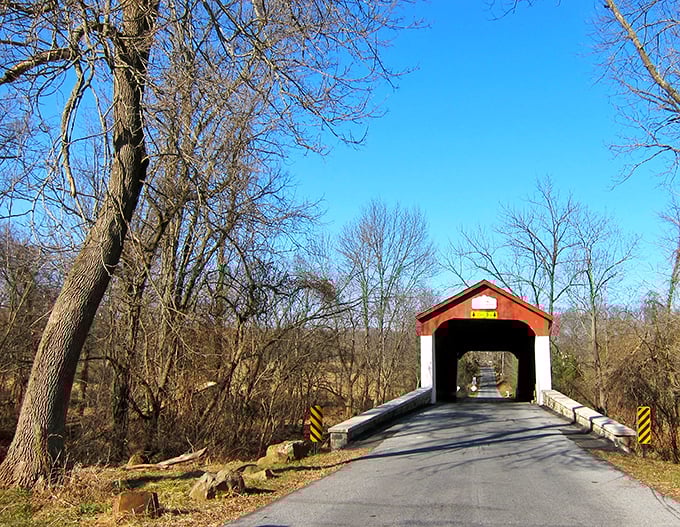 This red covered bridge isn't just crossing water&mdash;it's crossing time. Driving through feels like starring in your own historical movie.