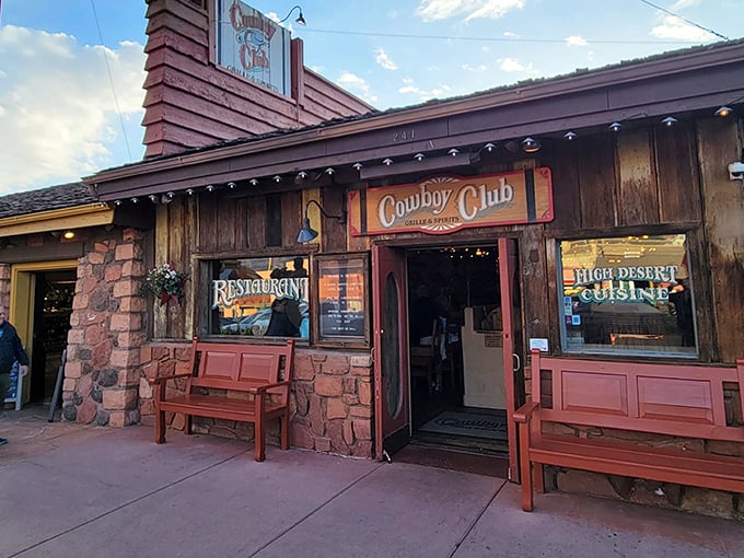 As the desert light fades, Cowboy Club's warm glow beckons hungry travelers with the promise of mesquite-grilled perfection amid Sedona's natural splendor.