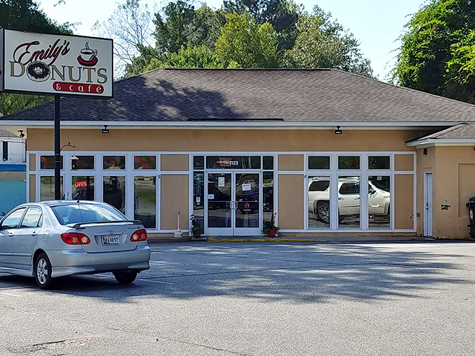 The welcoming storefront of Emily's Donuts beckons with promise. That sign might as well say "Happiness Sold Here."