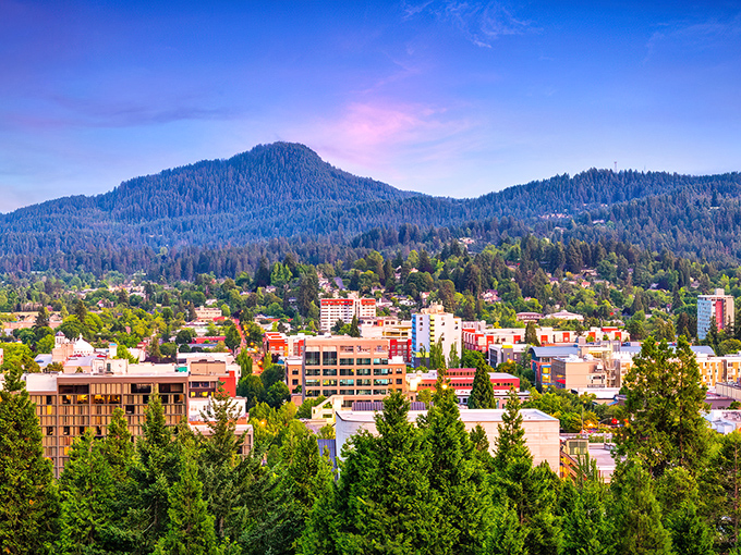 Downtown Eugene nestled against forested hills – where civilization and wilderness share a friendly border.