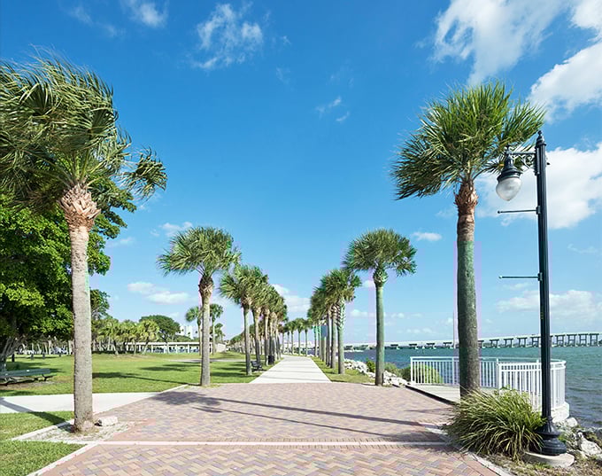 Palm trees stand sentinel along Fort Pierce's waterfront promenade. Florida as it was meant to be experienced.