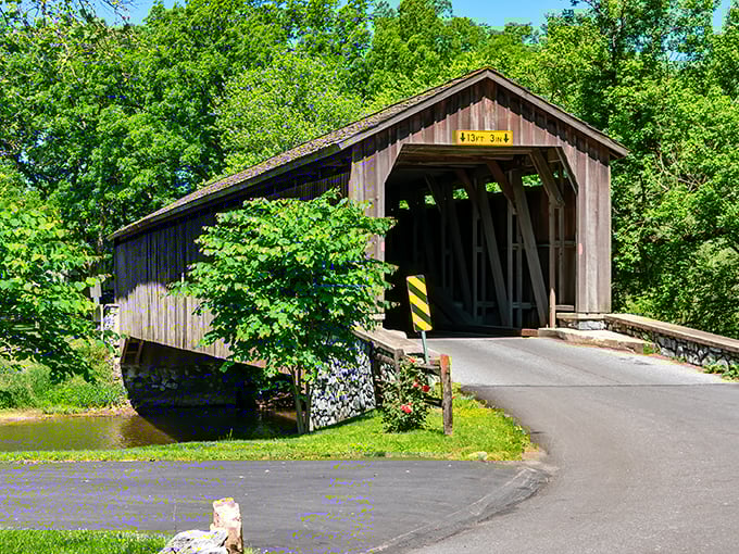 Summer greenery frames this weathered beauty, where the "13 FT 3 IN" sign is basically saying "come on in, we've got headroom!"