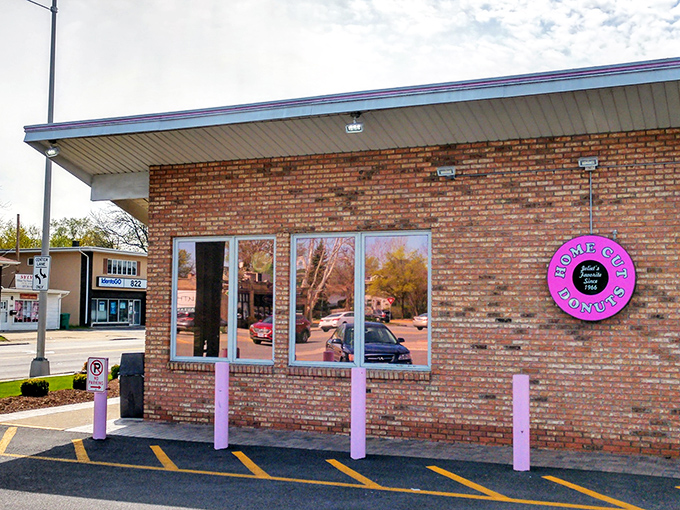 The pink "Home Cut Donuts" sign beckons like an old friend. This is where donuts are still made the way your grandparents remember them.