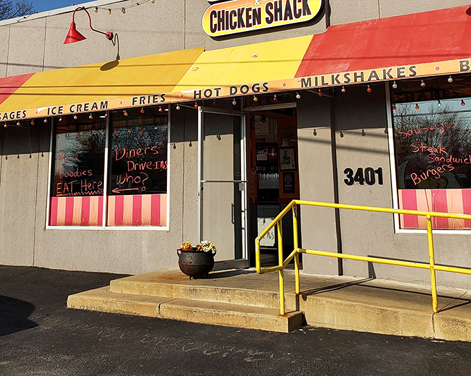 Classic diner vibes meet modern appetites at this cheerful red and yellow striped chicken haven. 