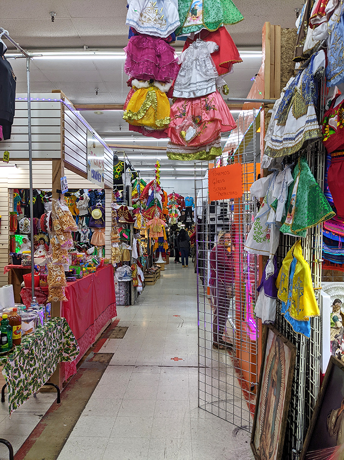 A rainbow explosion of traditional dresses transforms this Portland market into a cultural celebration you can touch.