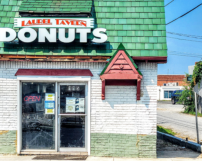 The classic white-and-green building stands like a beacon of hope for the donut-deprived. Worth every minute in line!