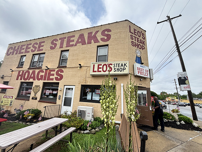 This unassuming beige building houses cheesesteak royalty. The sign promises, and the sandwich delivers—a perfect Philly equation.