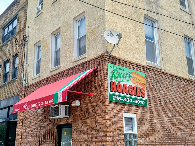 The corner spot with the red awning isn't just a sandwich shop &ndash; it's a Philadelphia institution where hoagie dreams come true.