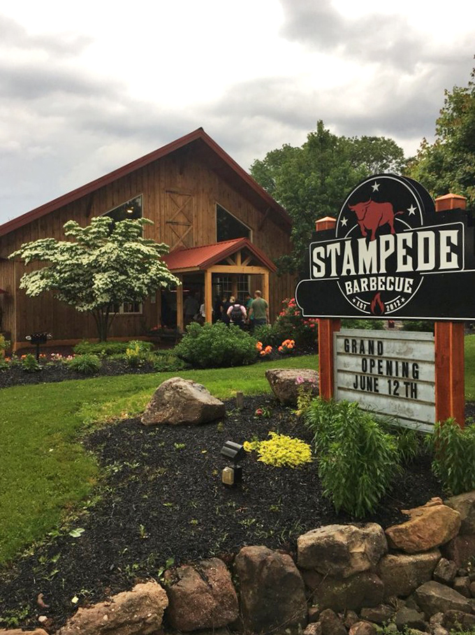 Stampede's barn-like charm and "Grand Opening" sign hint at BBQ traditions in the making. Fresh flowers, fresh smoke, fresh start!