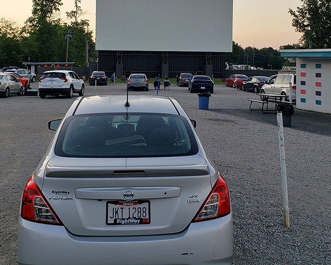 At Starlite Drive-In, some folks prefer the front-row experience. That gravel lot transforms into the best seats in Amelia once darkness falls.