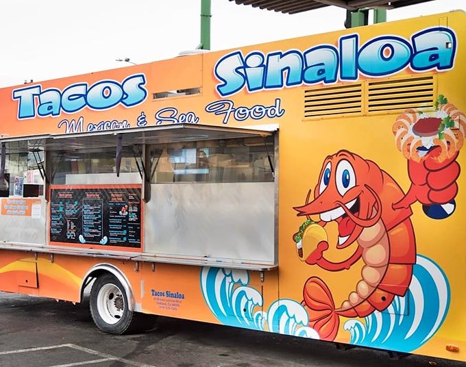 This bright orange taco truck isn't just eye-catching&mdash;it's a flavor beacon for seafood taco aficionados. Sinaloa's shrimp mascot knows what's up!