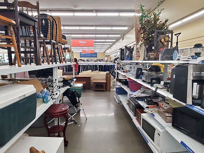 Value Village's organized aisles beckon with color-coded treasures. Like a department store, but every item has a secret past life.