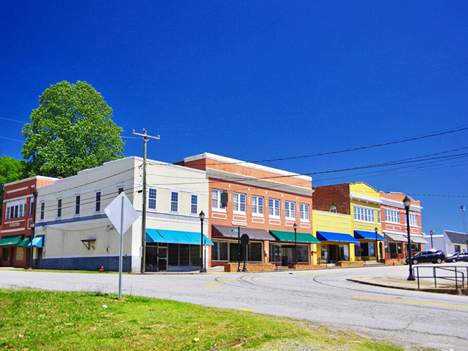 "Rainbow row, small-town edition! Whitmire's cheerful buildings stand shoulder-to-shoulder like old friends posing for a family portrait."