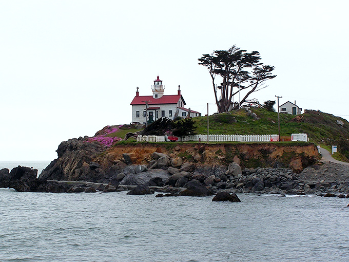 Battery Point Lighthouse stands defiantly on its rocky perch, accessible only when the tide permits – Mother Nature's way of saying "call ahead."