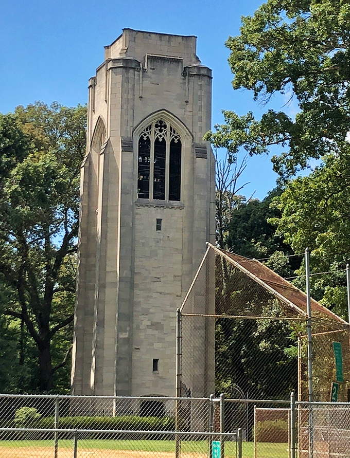 The Gothic-inspired bell tower reaches skyward like a medieval sentinel, a limestone reminder that architecture can transport us across both time and oceans.