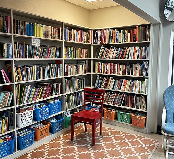 A bibliophile's dream corner where that red chair isn't just furniture&mdash;it's an invitation to lose yourself in someone else's story.