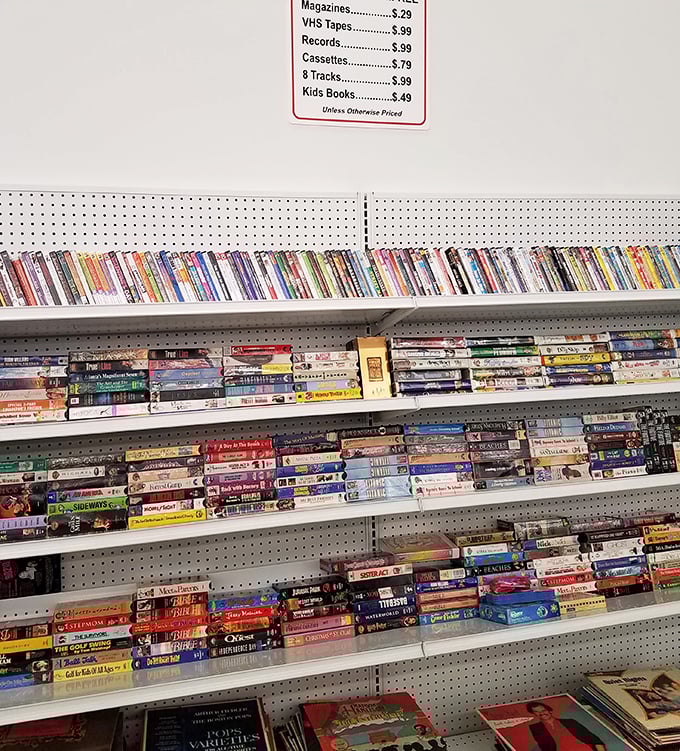 VHS tapes and vintage media line these shelves like a time capsule of entertainment history. Remember when "be kind, rewind" was life advice?