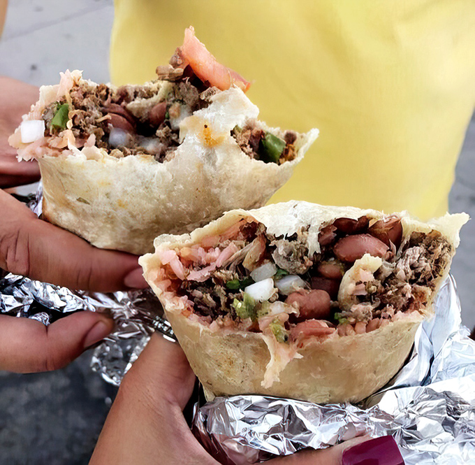Behold the cross-section of happiness: these burrito halves reveal the perfect meat-to-filling ratio that separates the legends from the pretenders.