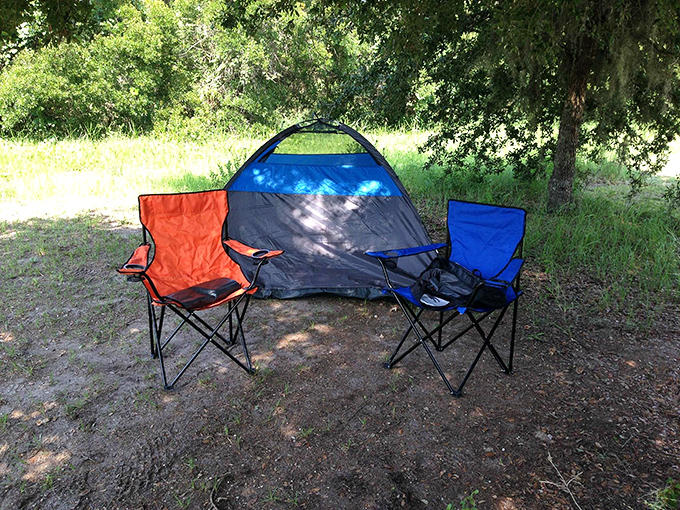Camping simplified: two chairs, a tent, and zero emails. This shady spot offers the perfect digital detox under Florida's natural canopy.