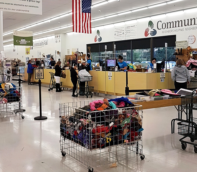 The checkout area buzzes with activity as shoppers' carts overflow with finds. That moment when buyers' remorse transforms into buyers' euphoria.