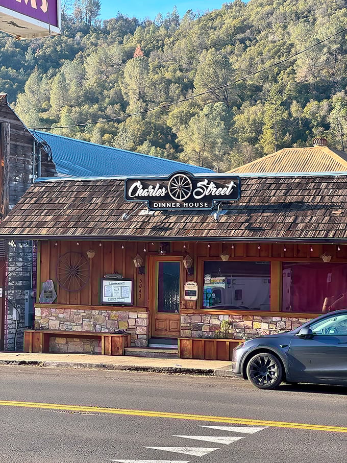 Charles Street Dinner House stands as a rustic time capsule with its wagon wheel charm and stone foundation. The Sierra Nevada foothills provide a perfect backdrop.