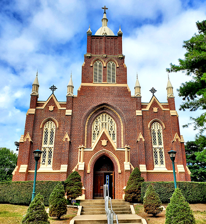 Old St. Vincent's Church reaches skyward with Gothic splendor, its brick facade and ornate windows telling stories of faith and craftsmanship from another era.