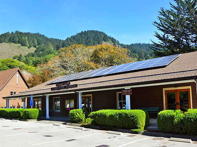 The Stinson Beach Community Center, with its solar panels catching California sunshine, serves as the town's living room where locals gather and visitors feel instantly at home.
