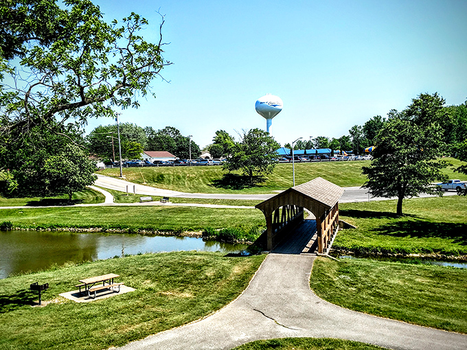 Community Park's covered bridge creates a scene straight from a retirement brochure&mdash;peaceful water, green spaces, and that iconic water tower watching over it all.
