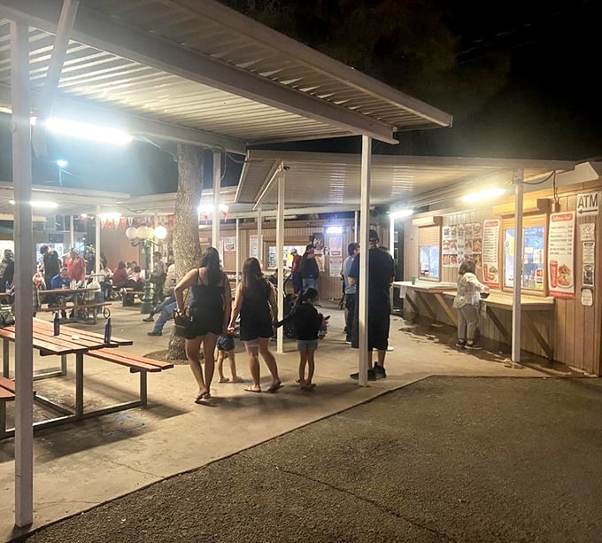 As the desert sun sets, the swap meet transforms into a lively night market where families gather to eat, shop, and create memories.