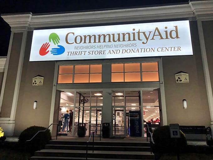 The "OPEN" sign glows like a green light to bargain hunters' paradise, where one person's castoffs become another's newfound treasures.